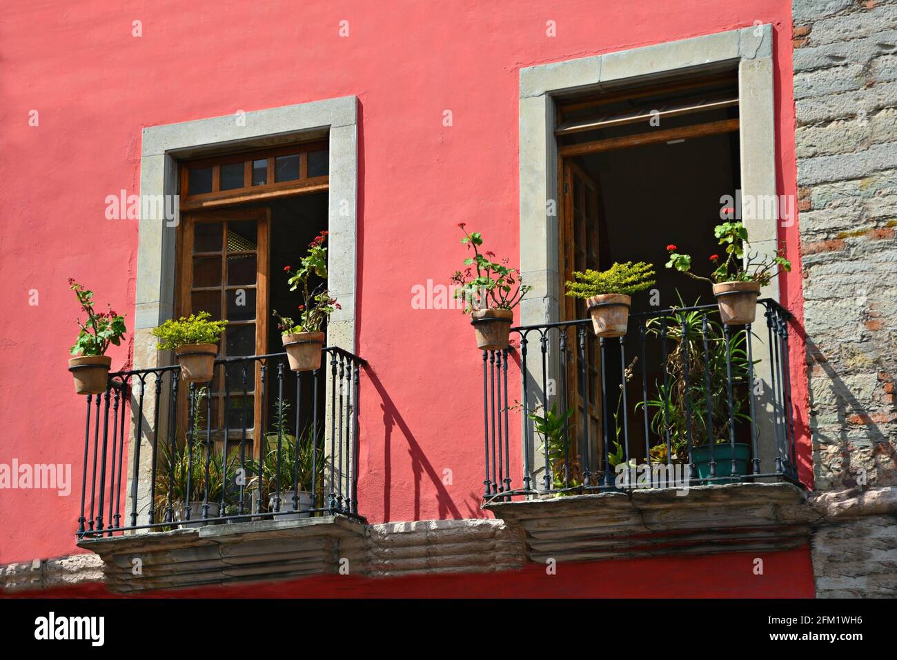 Spanish Colonial building facade with a Venetian stucco wall, wooden ...