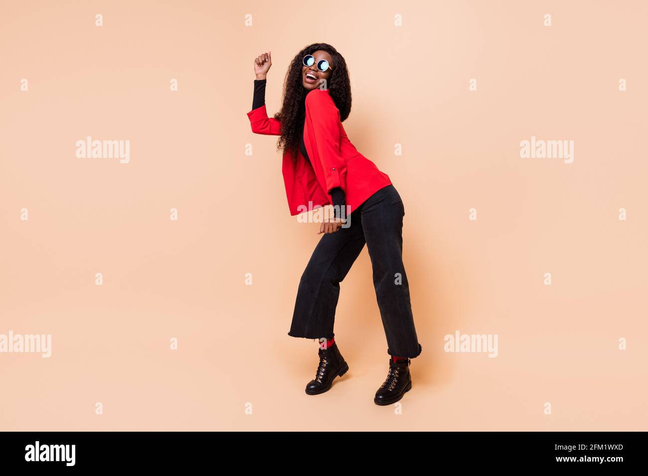 Full size profile side photo of afro american happy funky lady dance smile isolated on pastel ...