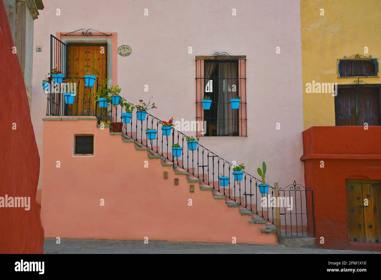Spanish Colonial building facade with a Venetian stucco wall, a wooden ...