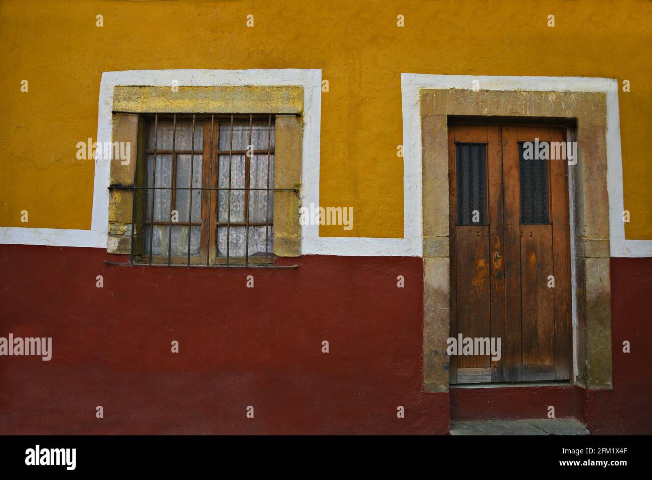 Spanish Colonial building facade with a Venetian ochre stucco wall, and ...