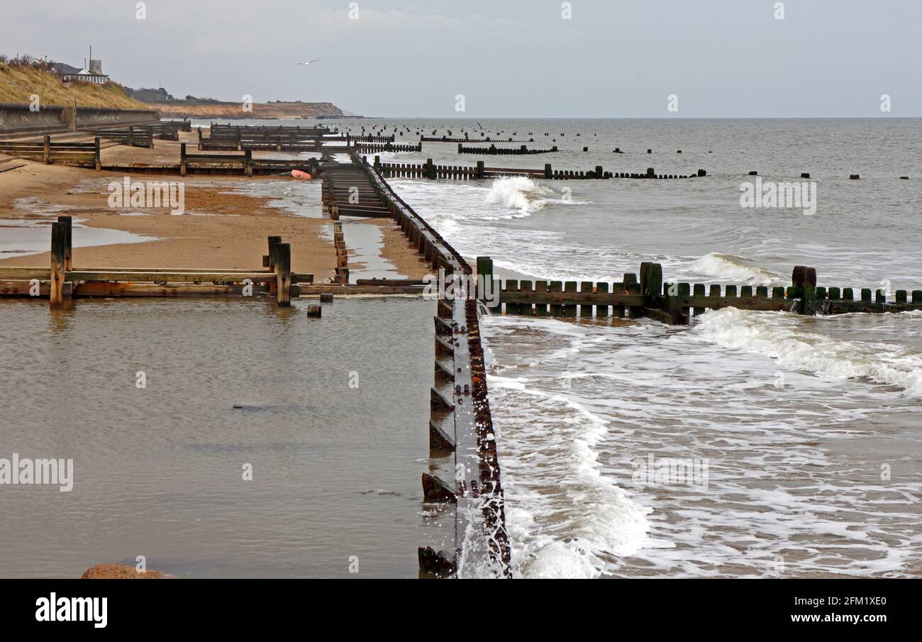 Old timber sea groynes hi-res stock photography and images - Alamy