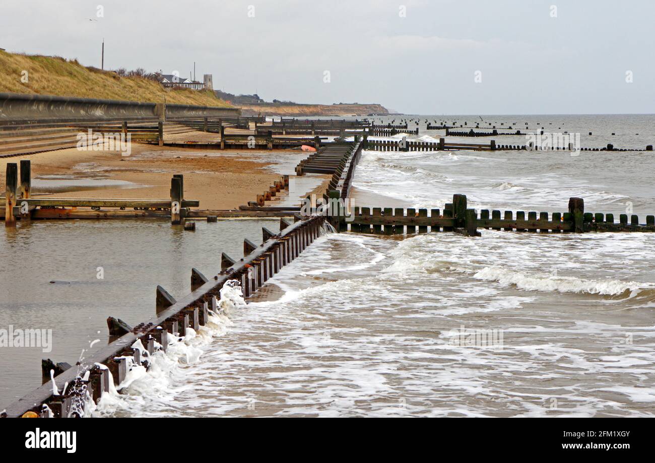A view of old unmaintained groynes and breakwaters on the shoreline on ...