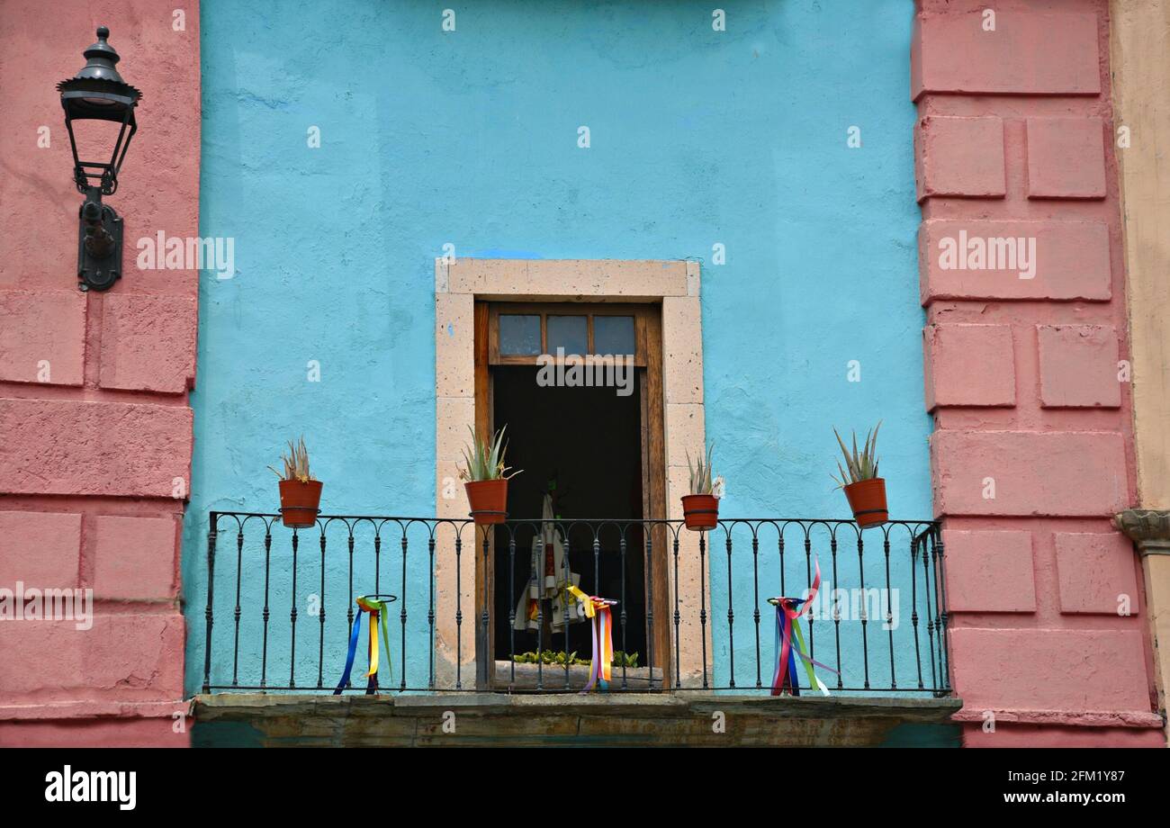 Spanish Colonial house with a Venetian stucco wall, stone trimmed ...