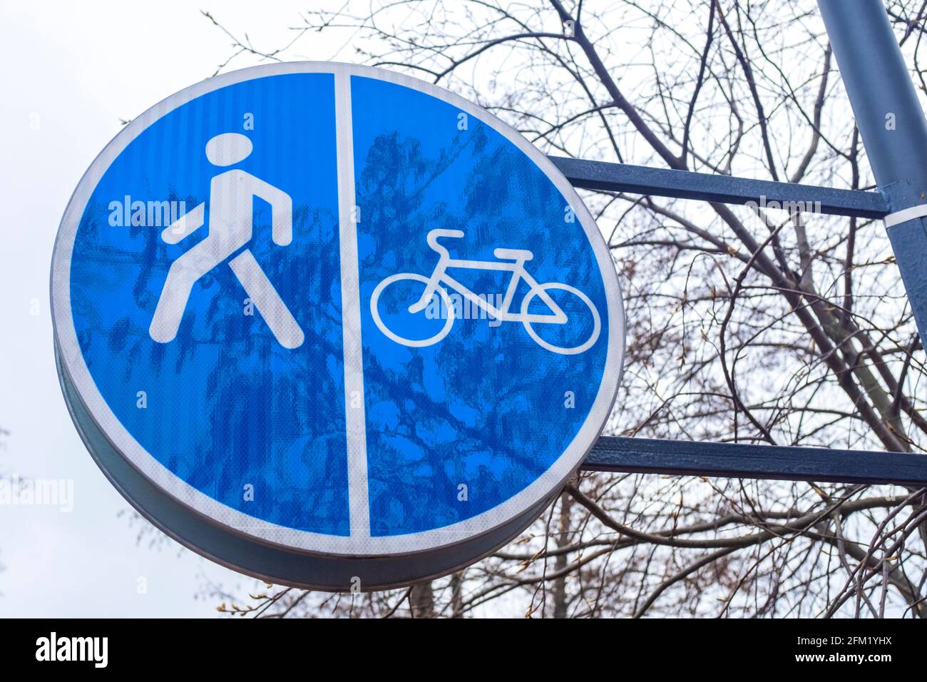 road sign blue circle with bike and figure of a man. cycling and ...