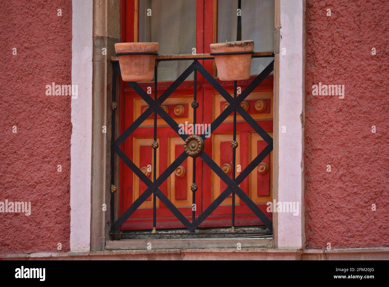 Spanish Colonial building with a Venetian stucco wall, stone trimmed ...