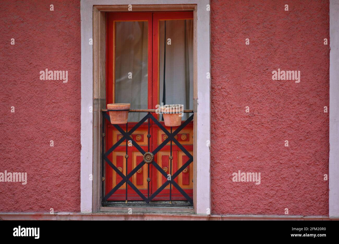 Spanish Colonial building with a Venetian stucco wall, stone trimmed ...