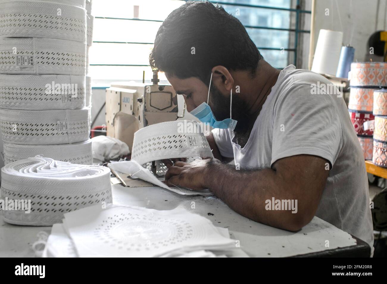 Dhaka, Bangladesh. 05th May, 2021. A worker wearing a face mask is seen ...