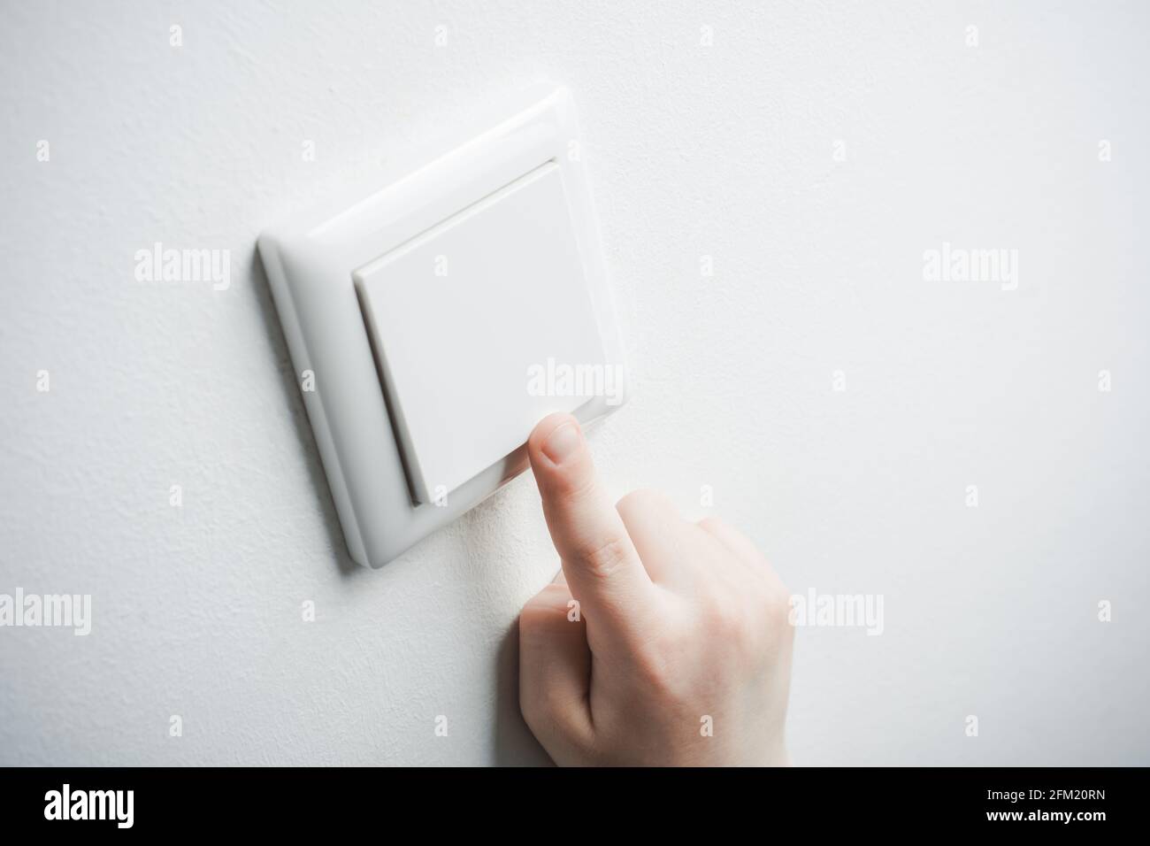 Child turning off light switch hi-res stock photography and images - Alamy
