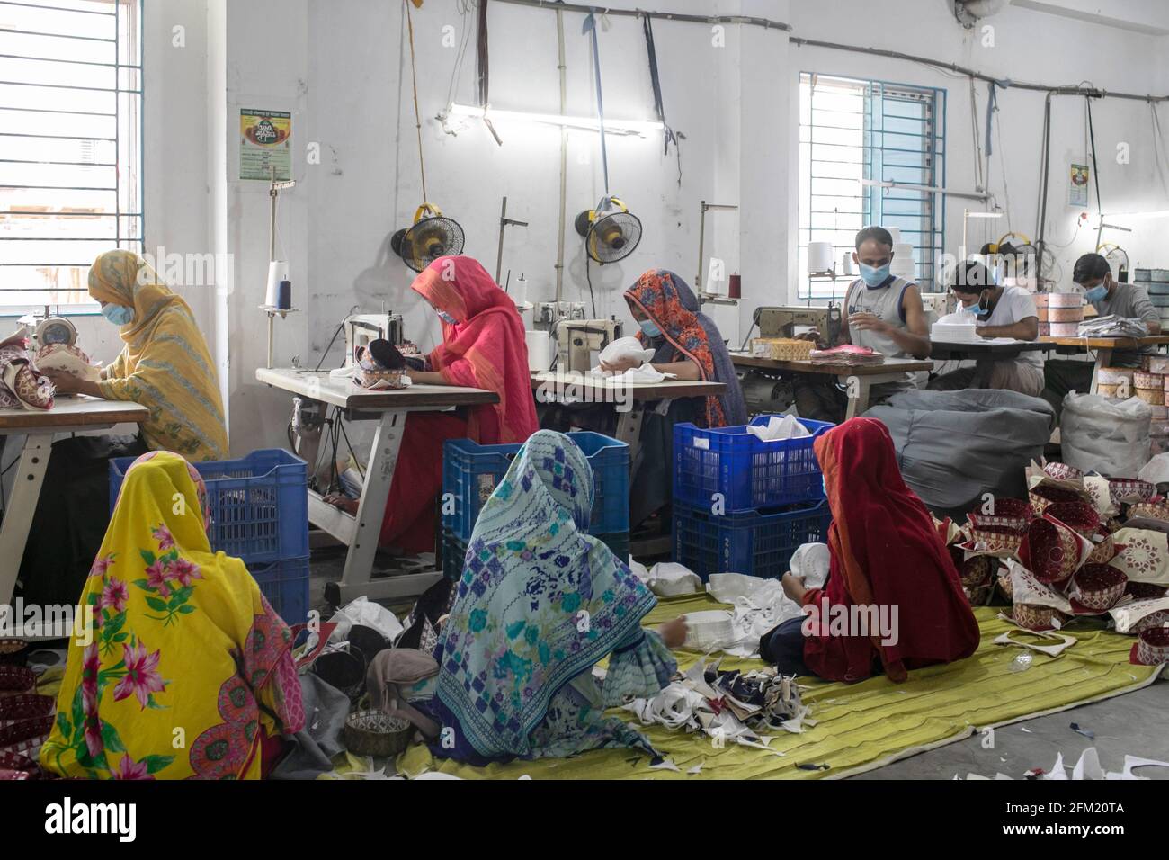Dhaka, Bangladesh. 05th May, 2021. A group of workers wearing masks are ...