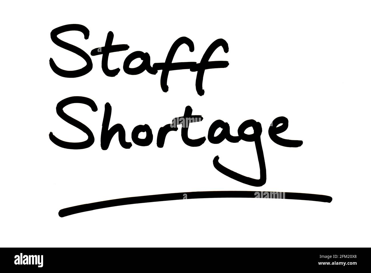 Staff Shortage, handwritten on a white background Stock Photo - Alamy