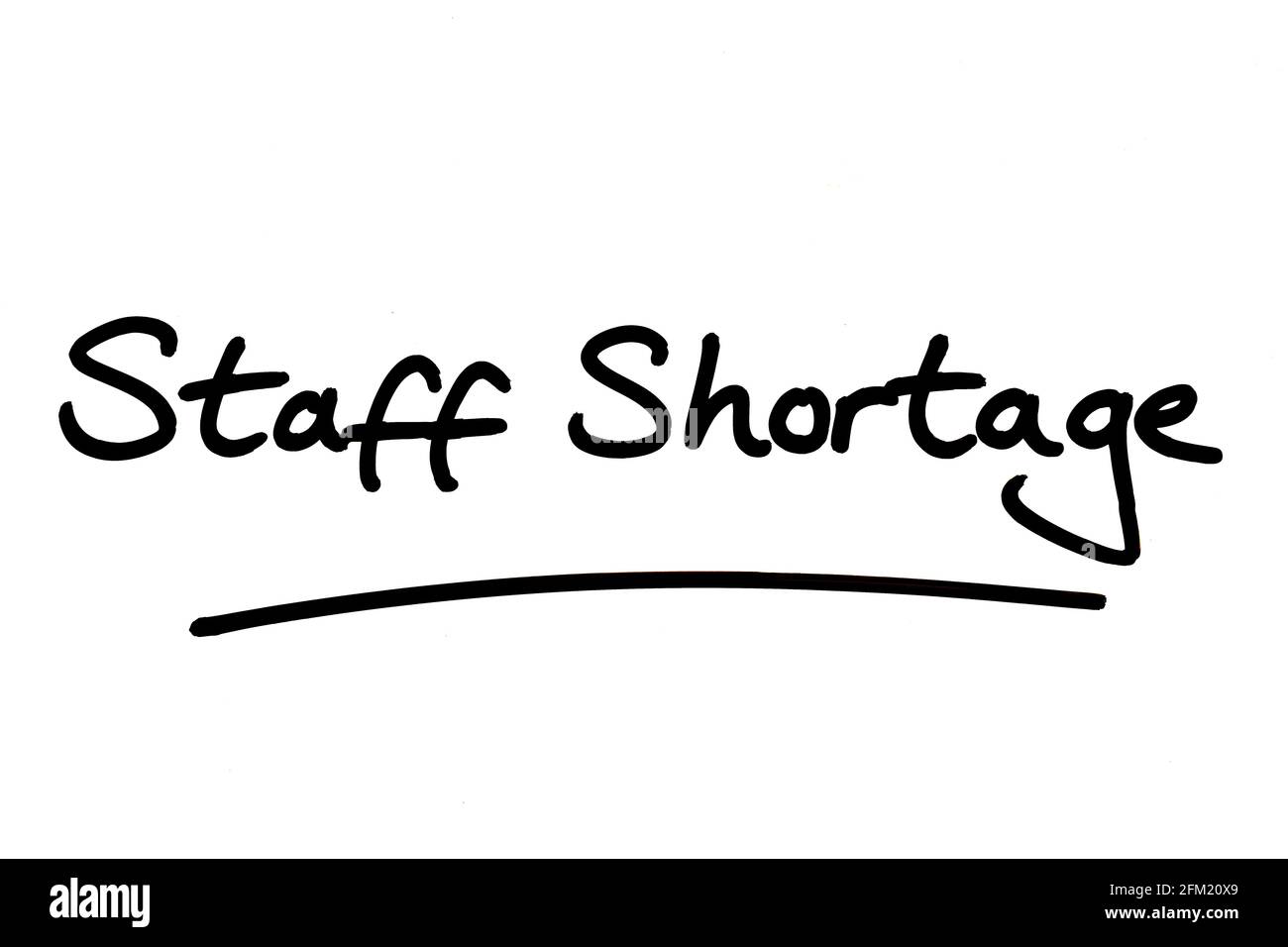 Staff Shortage, handwritten on a white background Stock Photo - Alamy