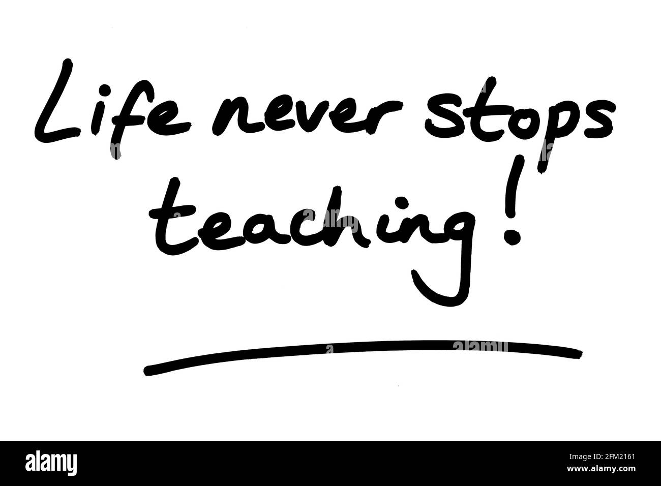 Life never stops teaching! handwritten on a white background Stock ...