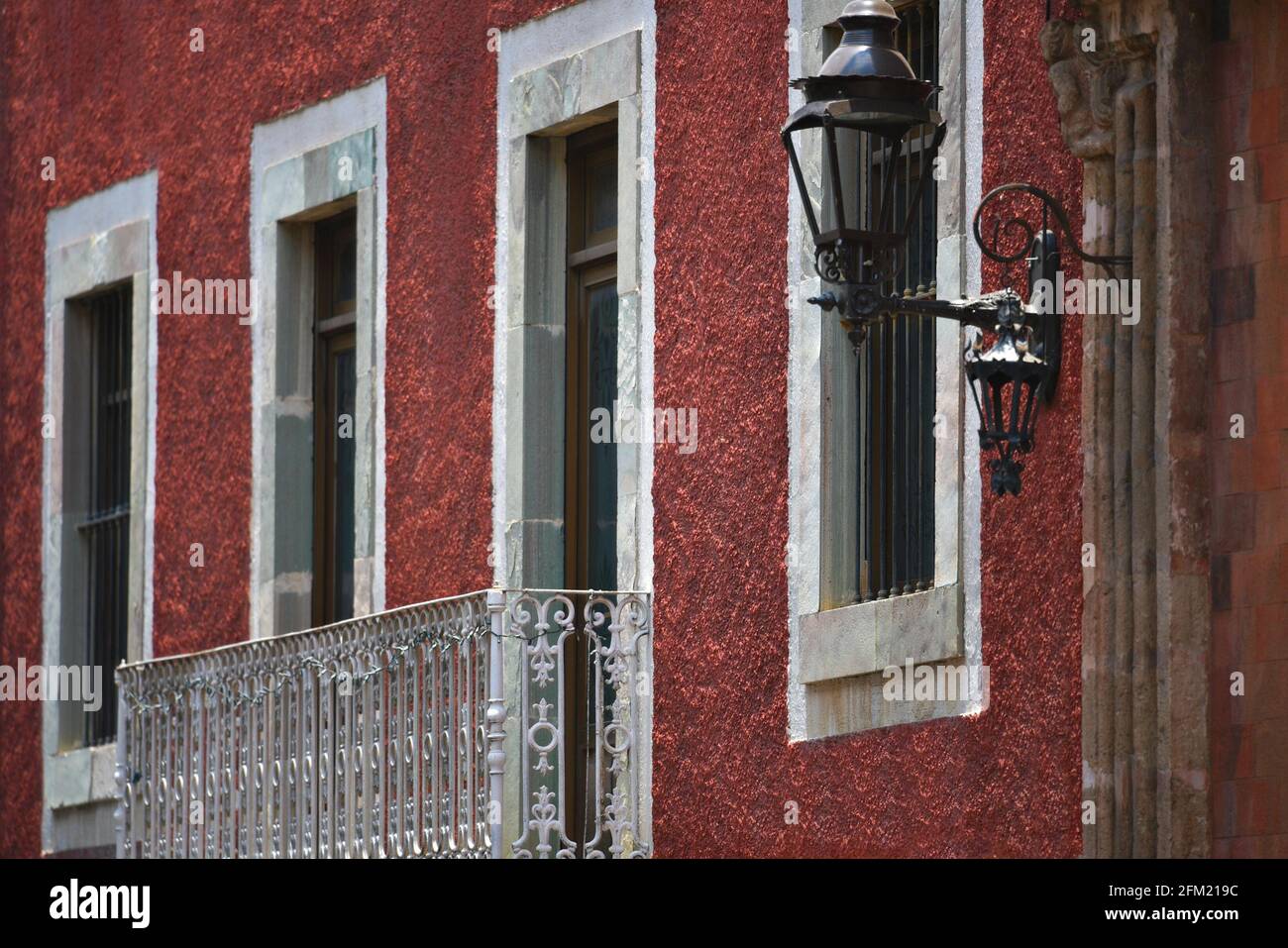 Spanish Colonial building facade with a Venetian red stucco wall ...