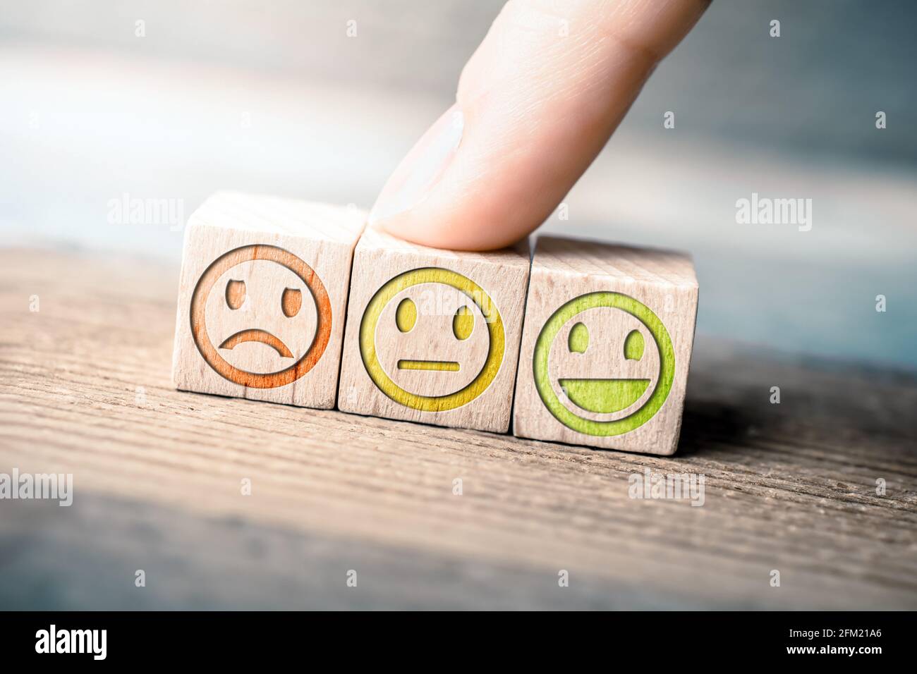 Average Feedback Concept With Red, Yellow And Green Smiling Faces On ...