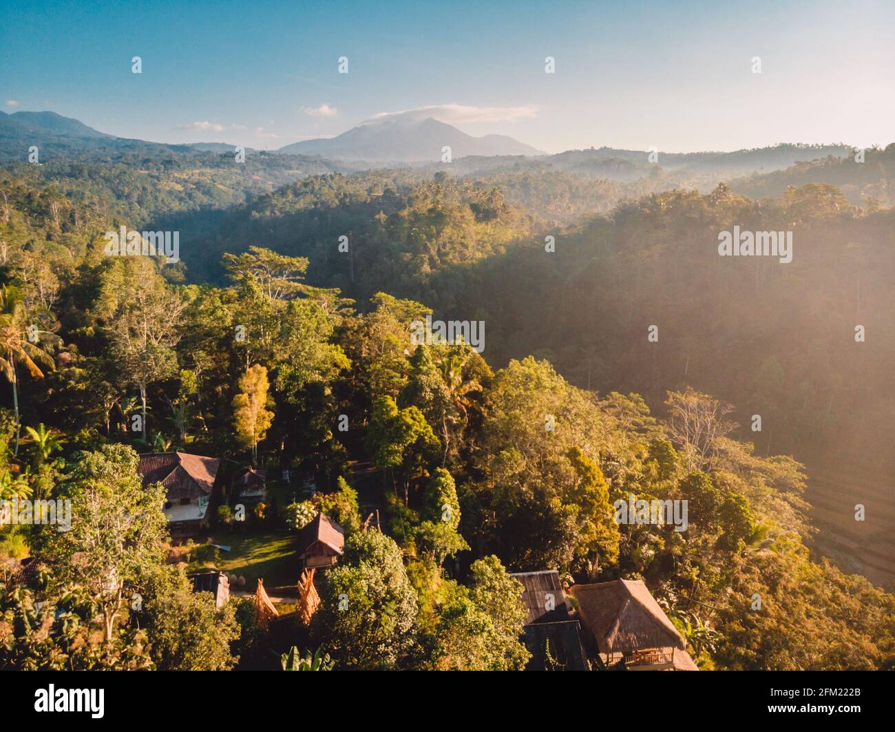 Aerial view of balinese village and mountains in Bali island, Indonesia ...