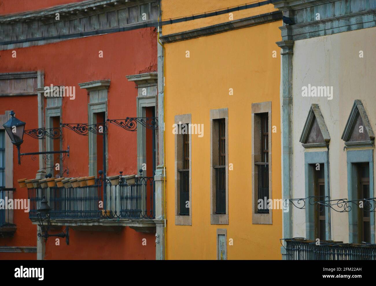Spanish Colonial buildings facade with Venetian red and ochre stucco ...