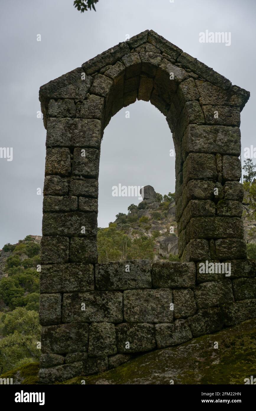 Ancient ruin stone structure building covered with moss near Sao Pedro ...