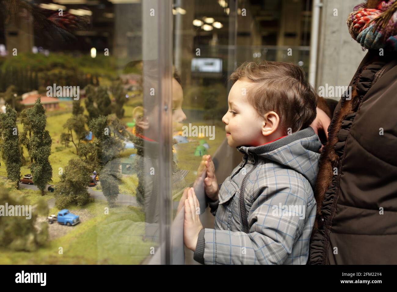 Child looking at toy park in the indoor playground Stock Photo - Alamy