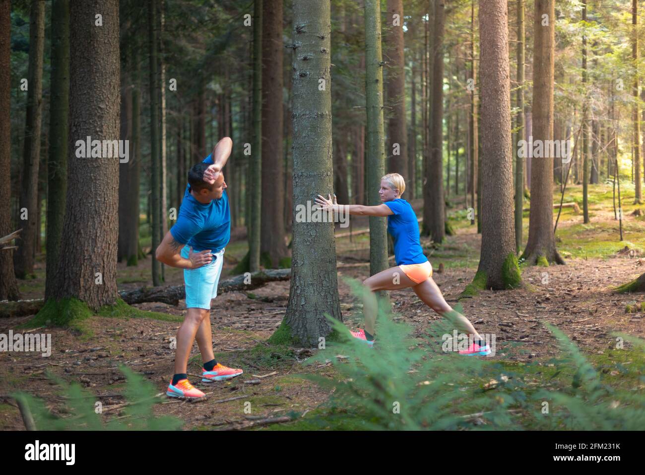 Couple leaning against a tree hi-res stock photography and images - Alamy