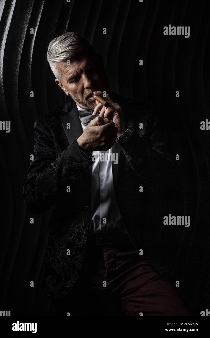 Lighting cigar hi-res stock photography and images - Alamy