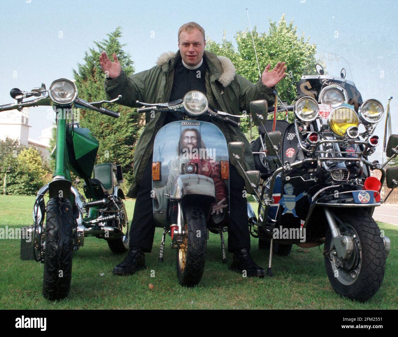 THE REV. MIKE BROTHERTON WITH HIS COLLECTION OF SCOOTERS. PIC MIKE ...