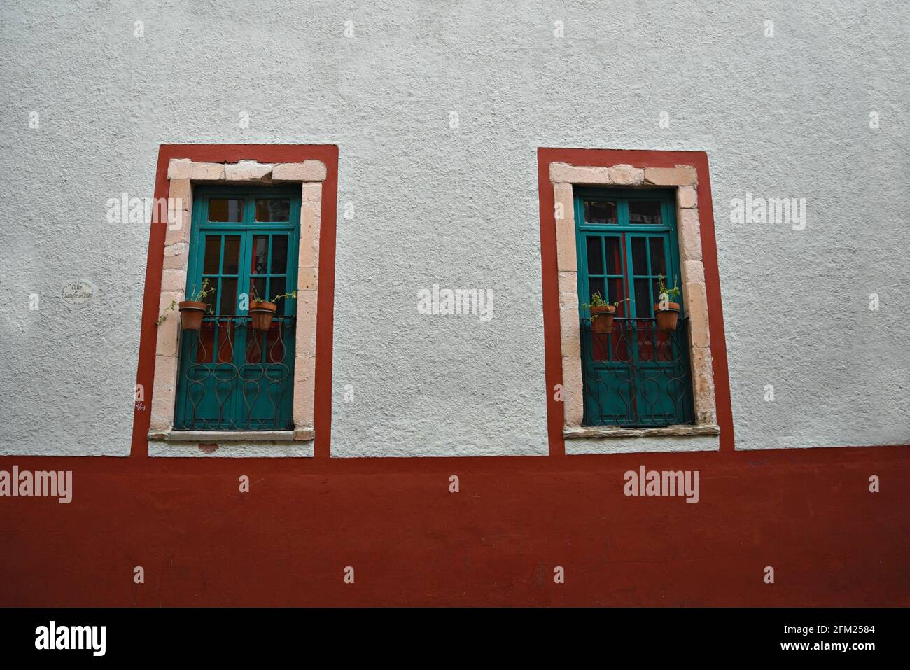 Picturesque Spanish Colonial house facade with a Venetian stucco wall ...