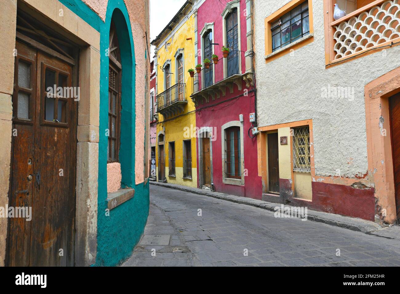 Spanish Colonial houses with colorful Venetian stucco walls in the ...