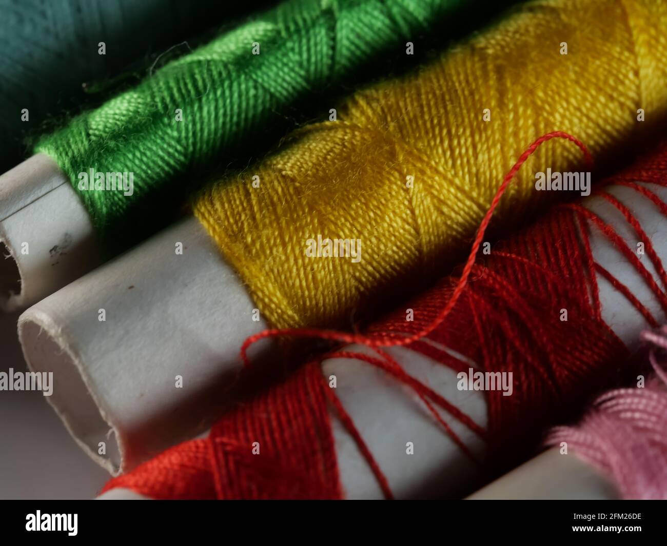 Sewing threads multicolored background closeup, selective focus, macro ...