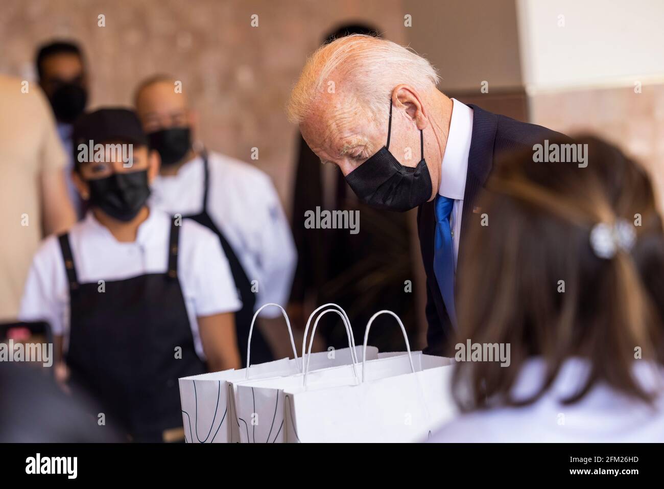 US President Joe Biden picks up tacos during a visit to Las Gemelas ...