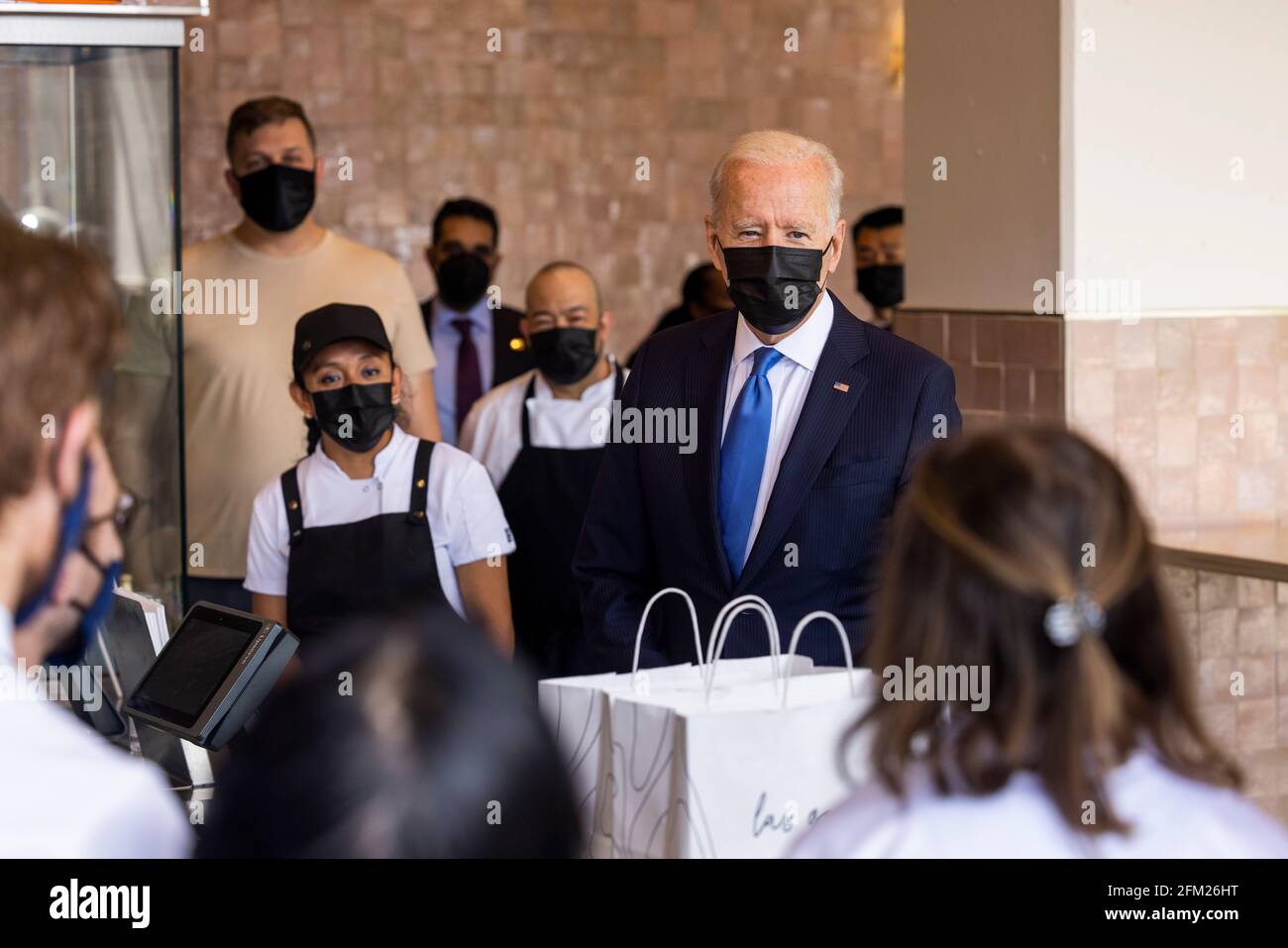 US President Joe Biden picks up tacos during a visit to Las Gemelas ...