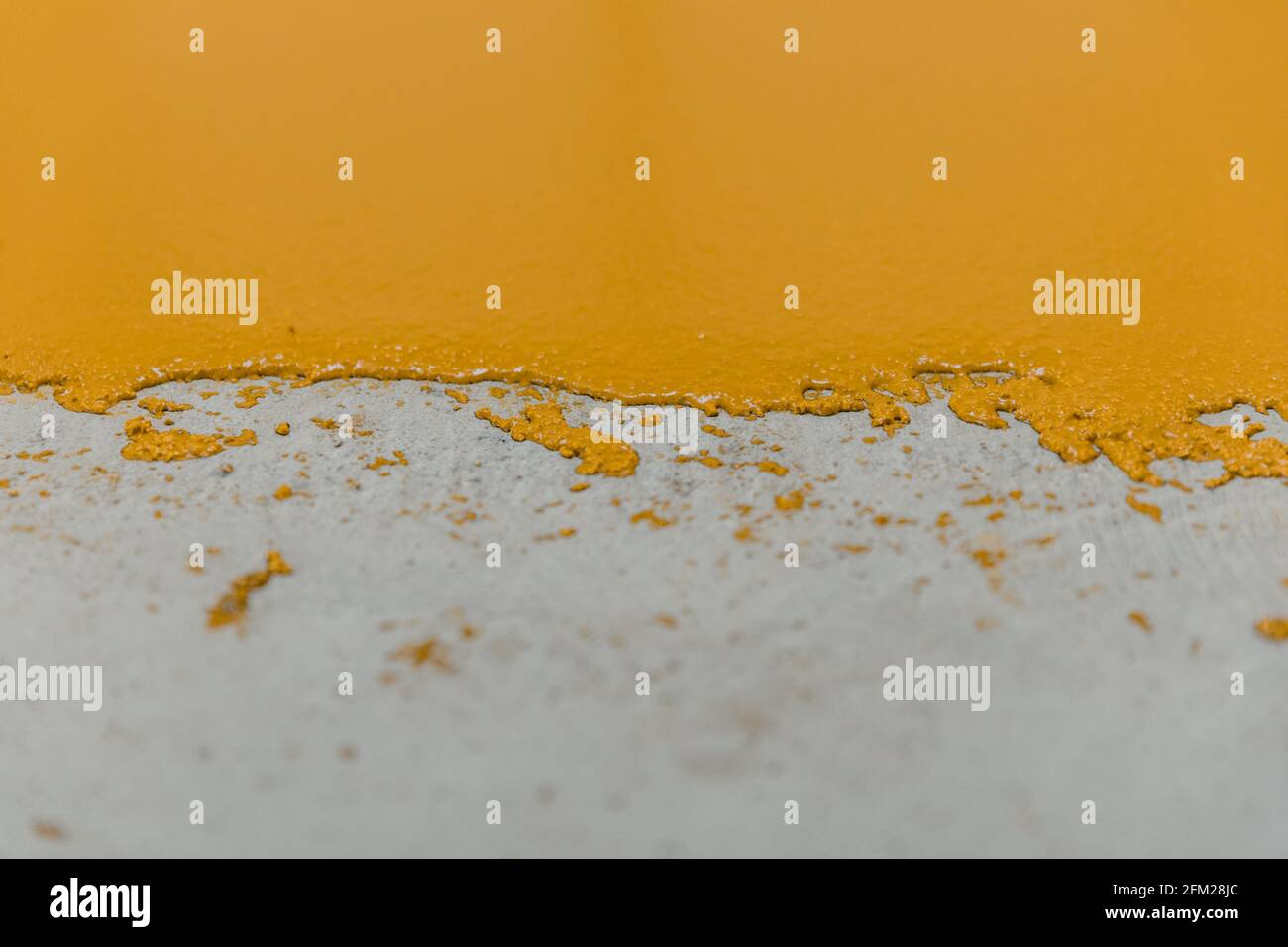 Selective focus on the yellow floor of freshly applied epoxy mortar ...