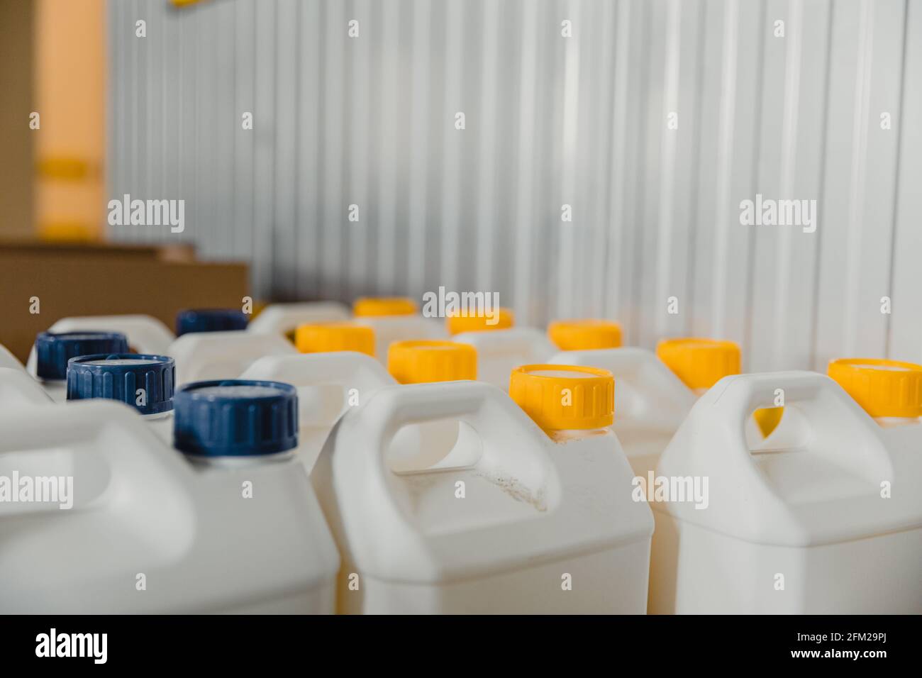 Plastic container cans for liquid chemical solutions Stock Photo - Alamy
