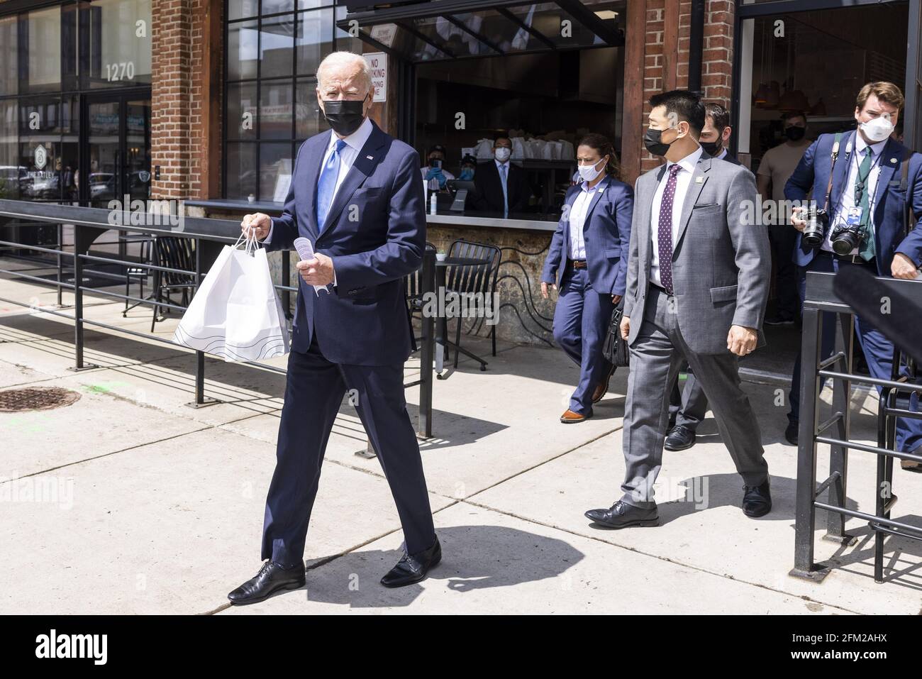 Washington, United States. 05th May, 2021. President Joe Biden picks up ...