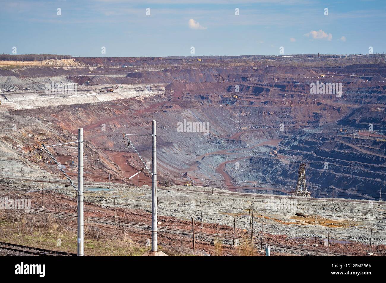 Power lines, the boom of a walking excavator against the background of ...