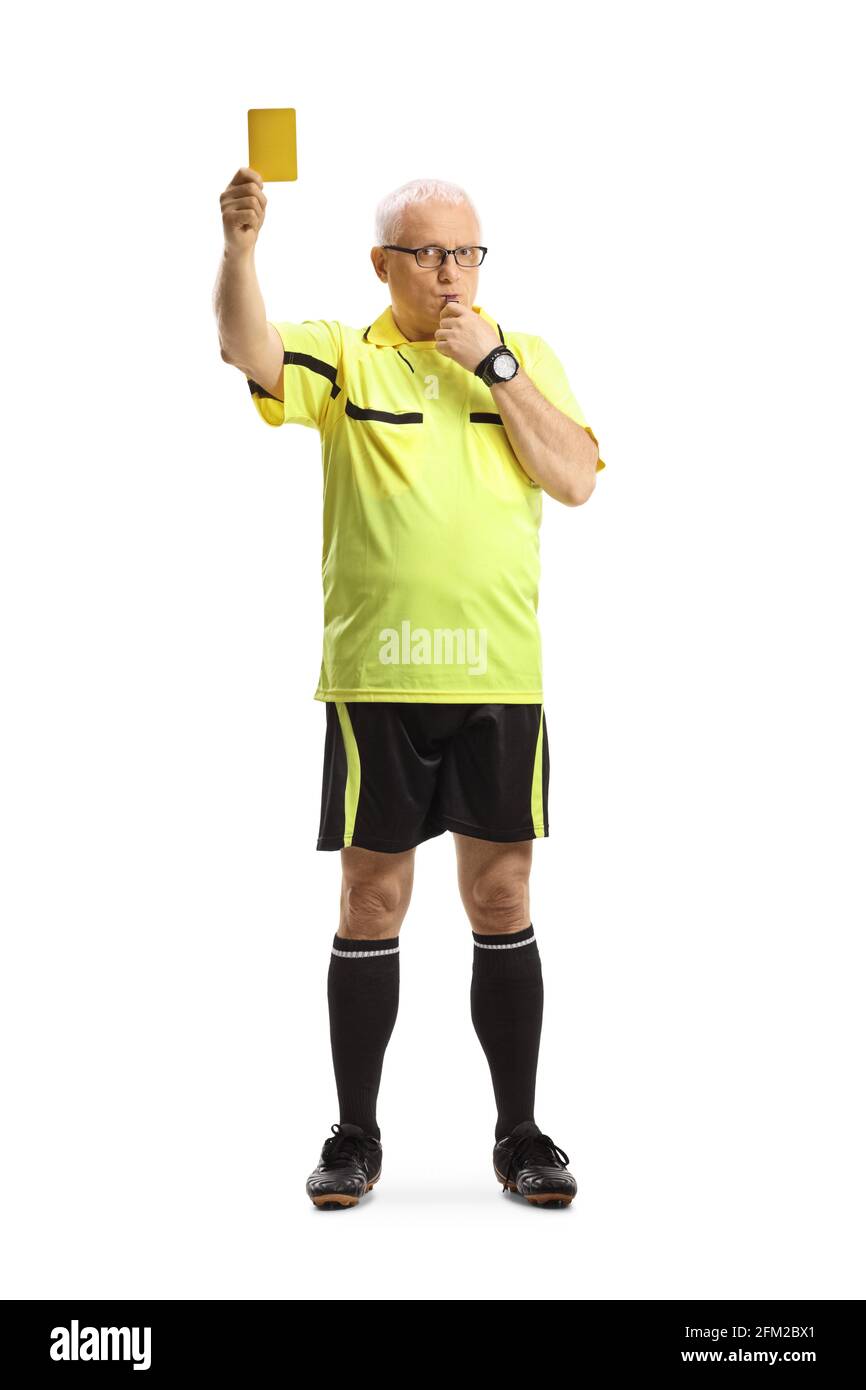 Full length portrait of a football referee showing a yellow card and ...