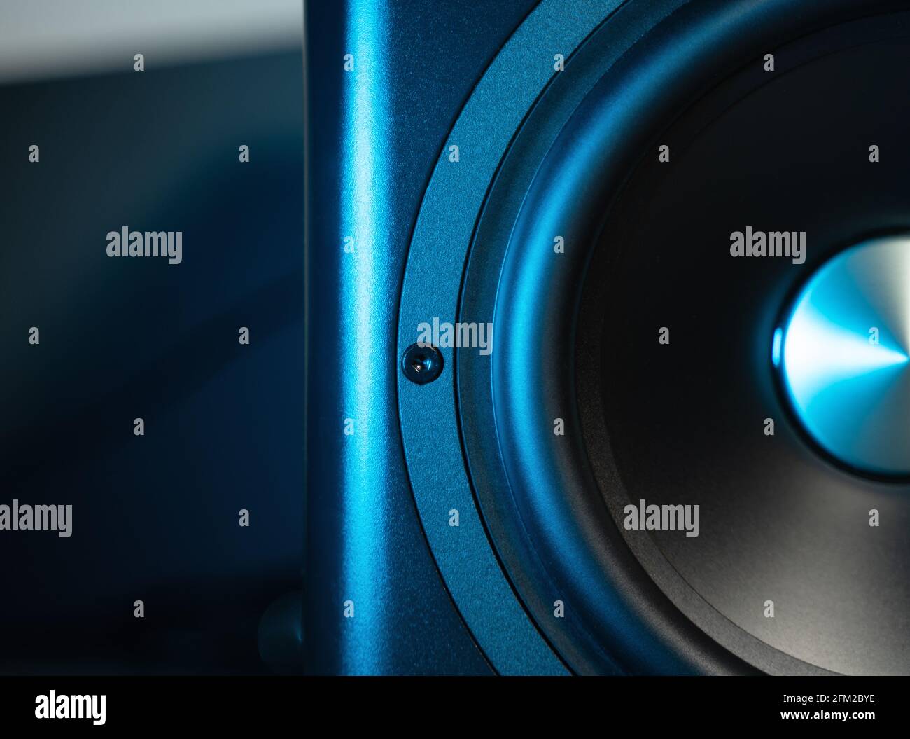 Front close up view of modern sub-woofer with blue highlights. Close-up ...