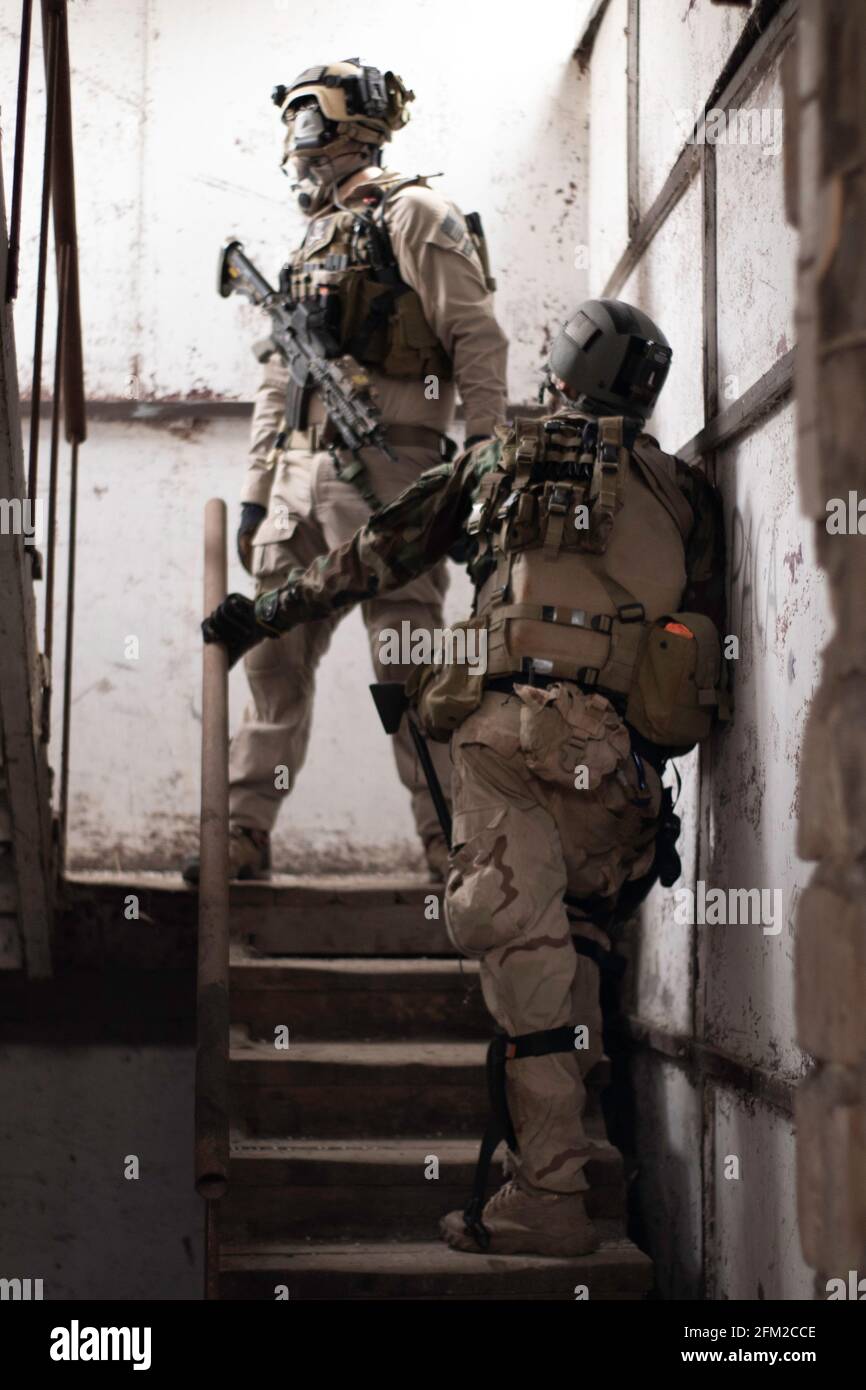 two guys in american military uniform stand on the stairs, airsoft ...