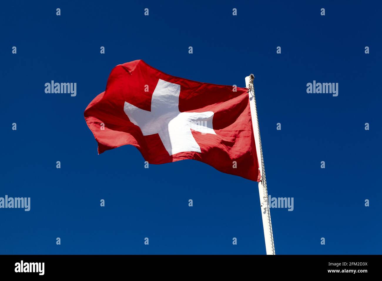 Flag of Switzerland is waving on the sky background Stock Photo - Alamy