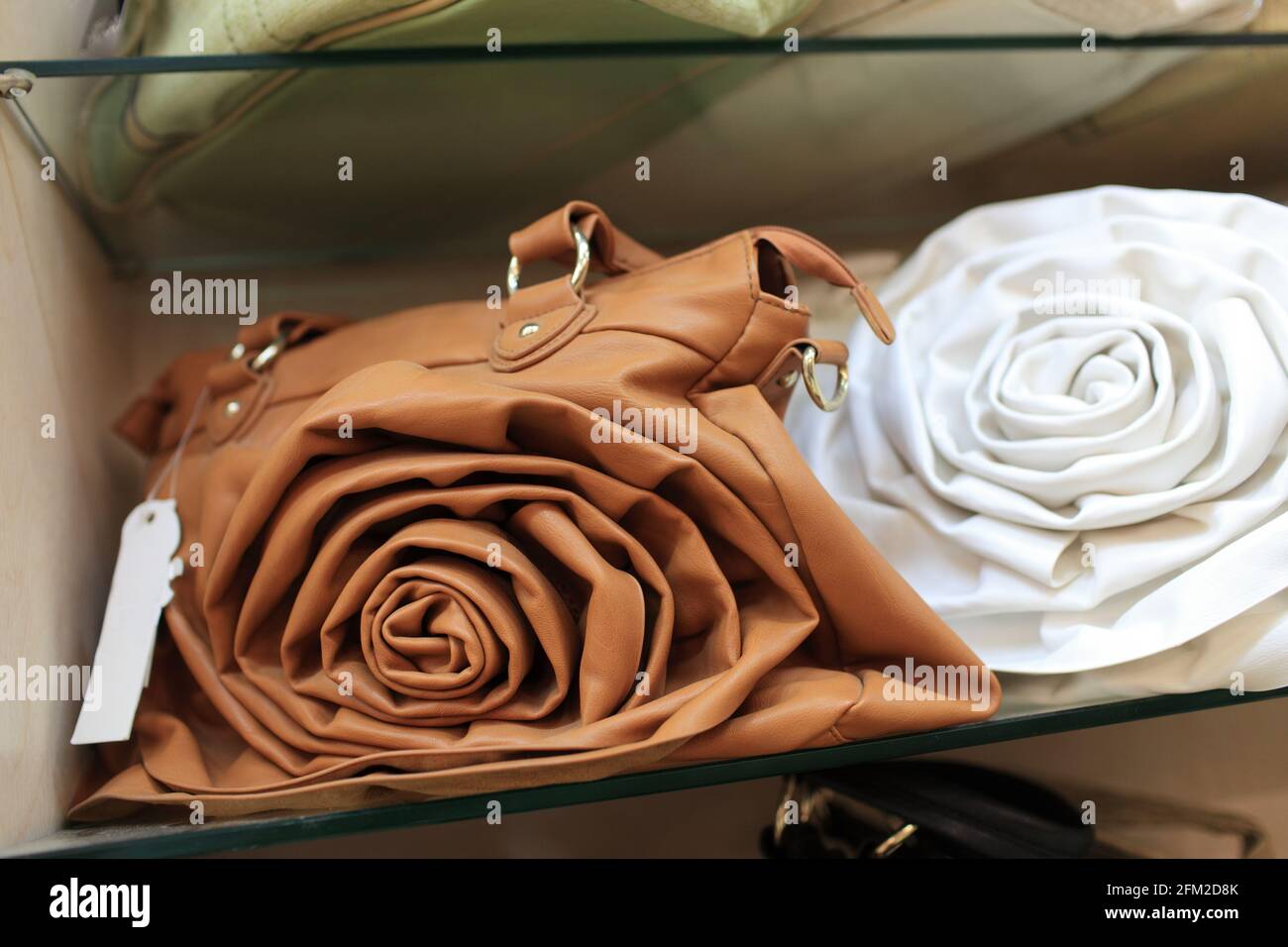 Handbags on a shelf in the department store Stock Photo - Alamy
