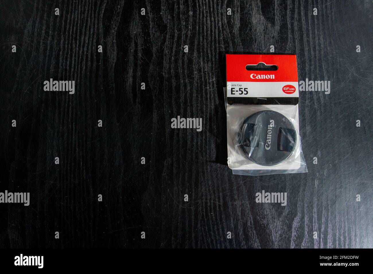 A Canon E-55 55mm diameter lens cap Stock Photo - Alamy