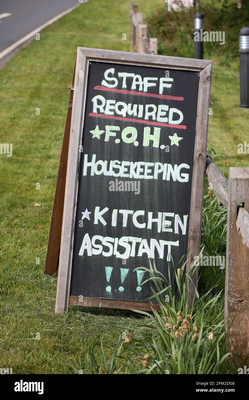 Staff required sign outside a pub in Sussex, UK Stock Photo - Alamy