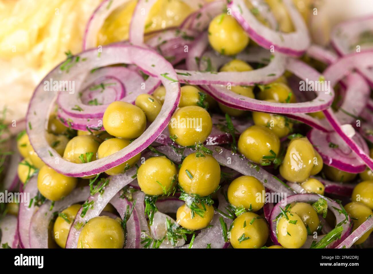 Marinated green peas with sliced red onion and fresh dill. Macro. Can ...