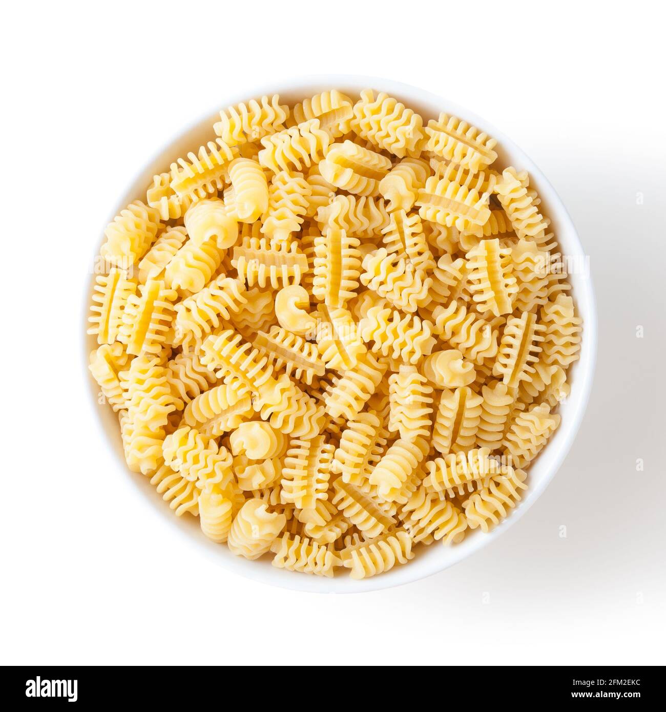 Uncooked radiatori pasta in white ceramic bowl isolated on white ...