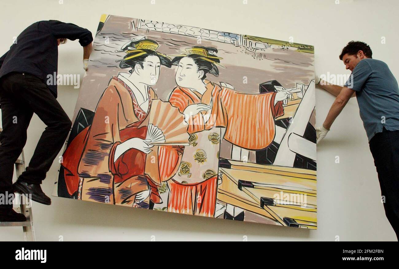 Staff at the Jerwood gallery in South London hang a piece by artist ...