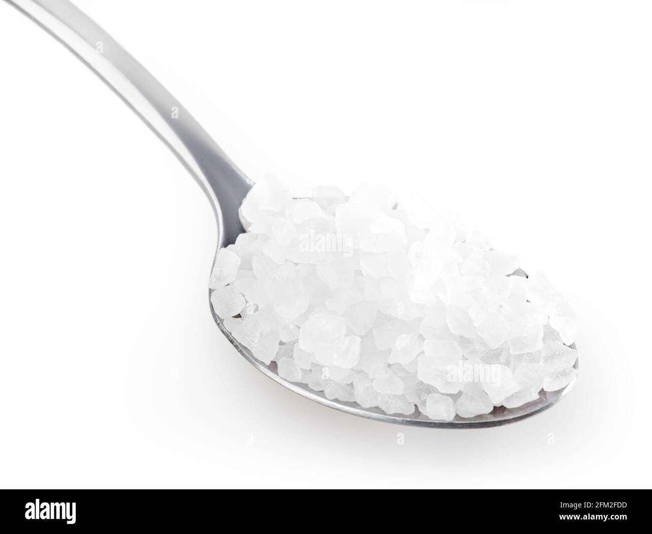 Spoon of sea salt isolated on white background with clipping path Stock ...