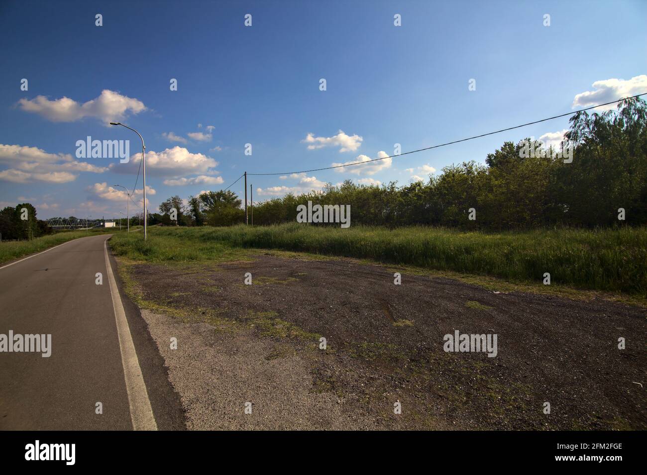 Road in the italian countryside in spring on a clear day Stock Photo ...