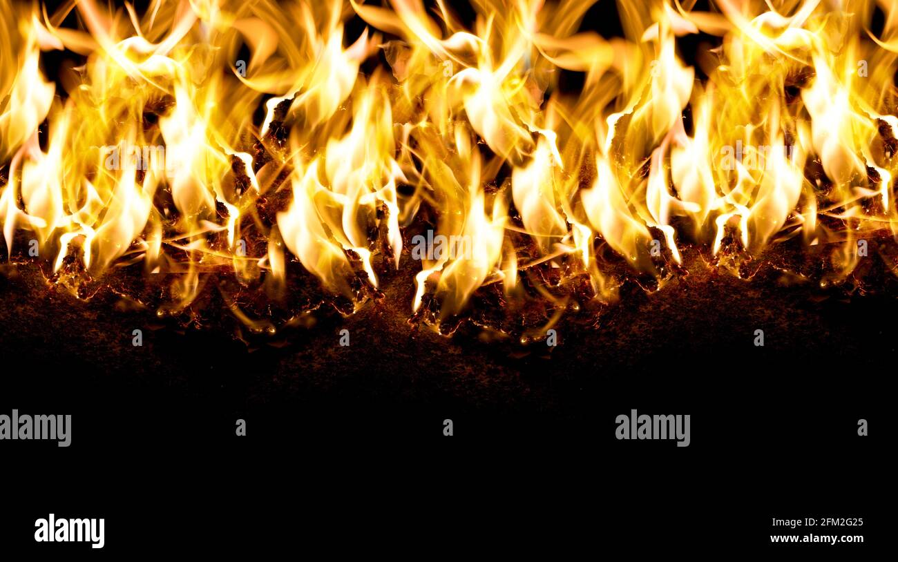 Burning papers on the ground fire flame close up shot isolated on black ...