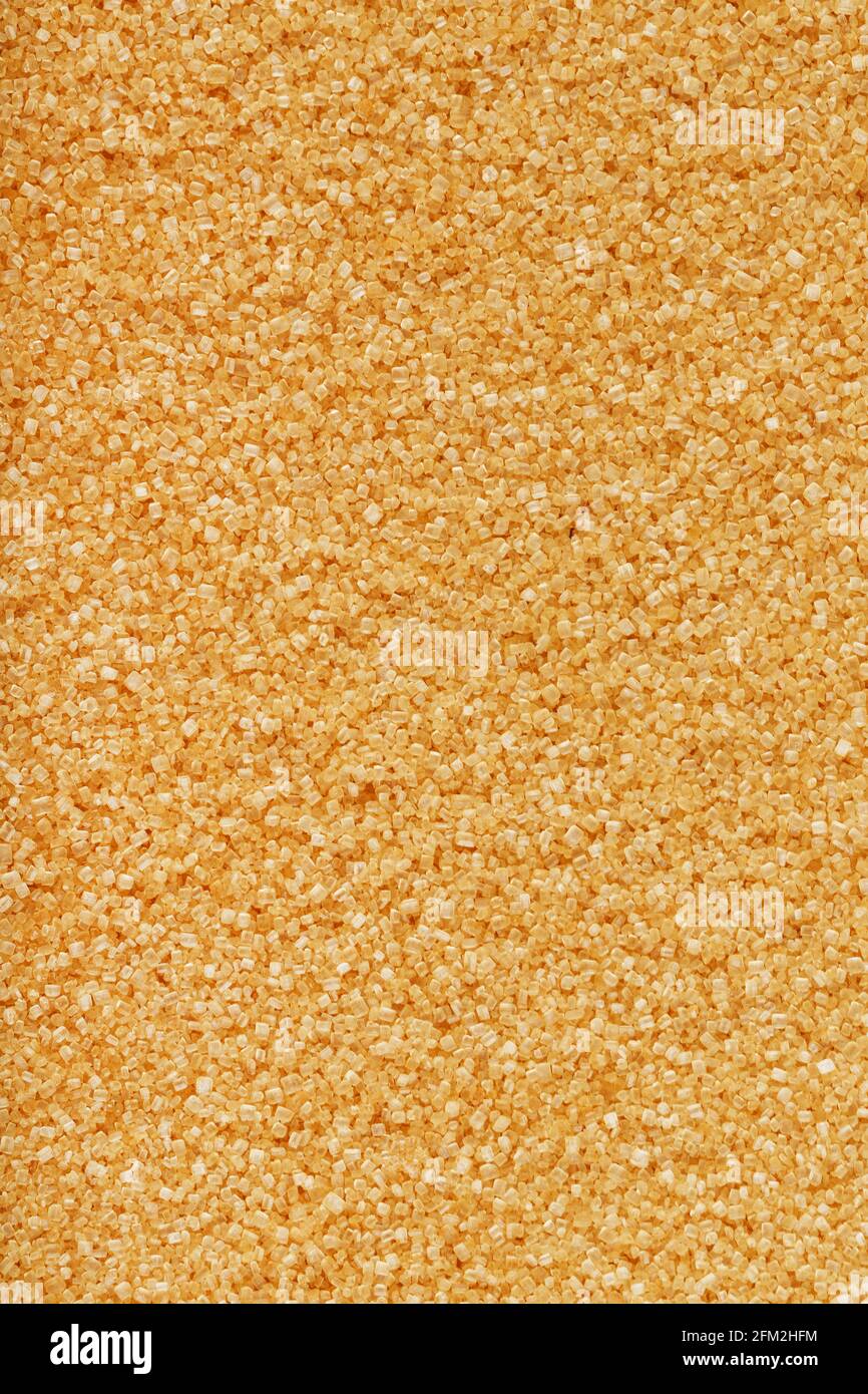 Texture of golden sand on the beach with a solid background in full ...