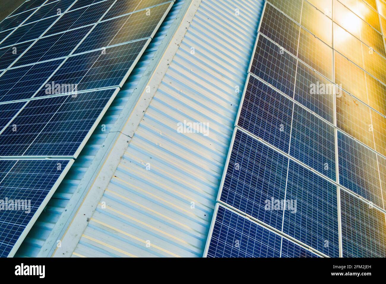 Aerial view of surface of blue photovoltaic solar panels mounted on ...