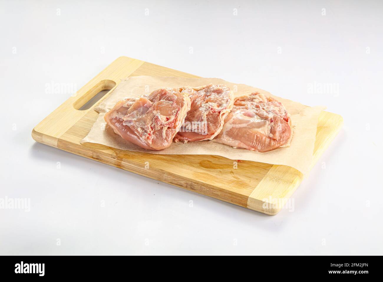 Raw chicken leg fillet uncooked over board Stock Photo - Alamy